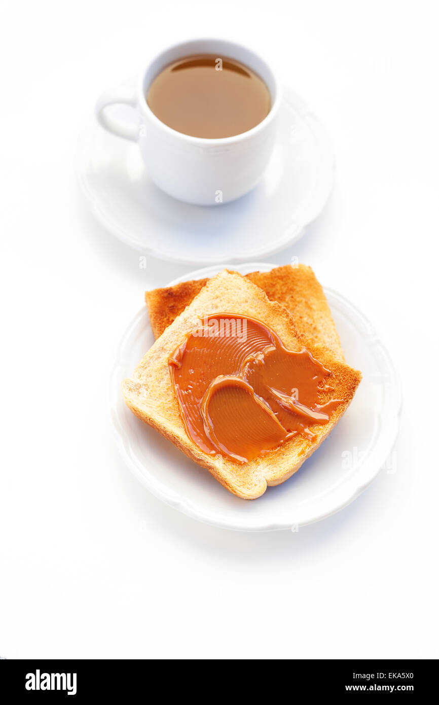 tea and toast with caramel isolated on white Stock Photo - Alamy
