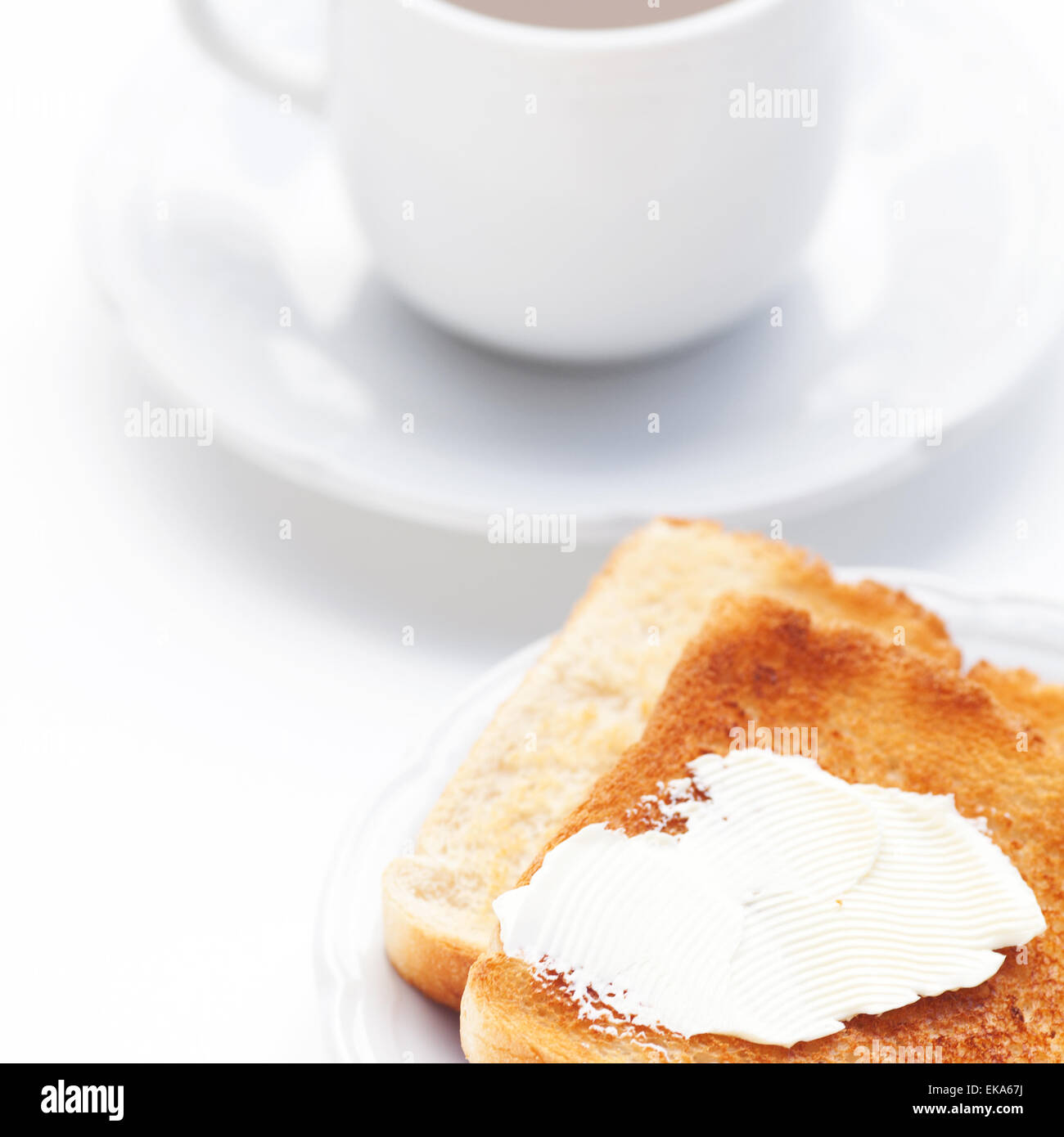tea and toast with butter isolated on white Stock Photo - Alamy