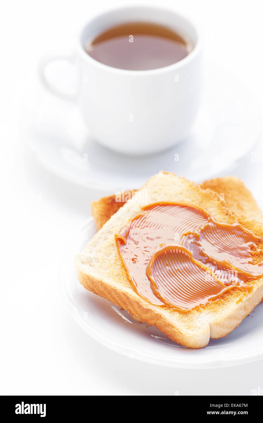 tea and toast with caramel isolated on white Stock Photo - Alamy