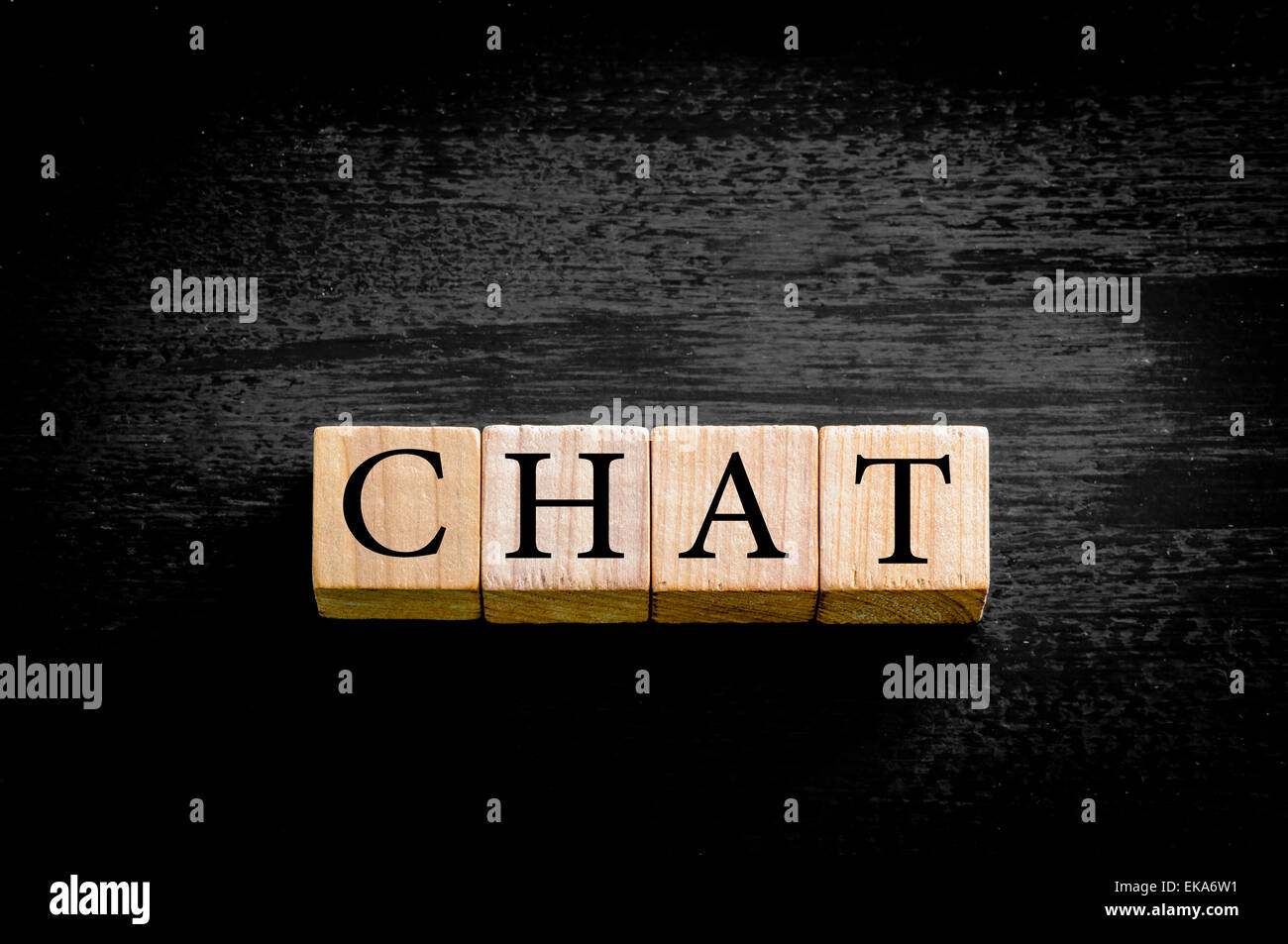 Word CHAT. Wooden small cubes with letters isolated on black background ...