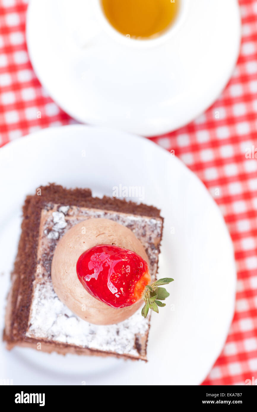 beautiful cake with strawberry and tea on plaid fabric Stock Photo - Alamy