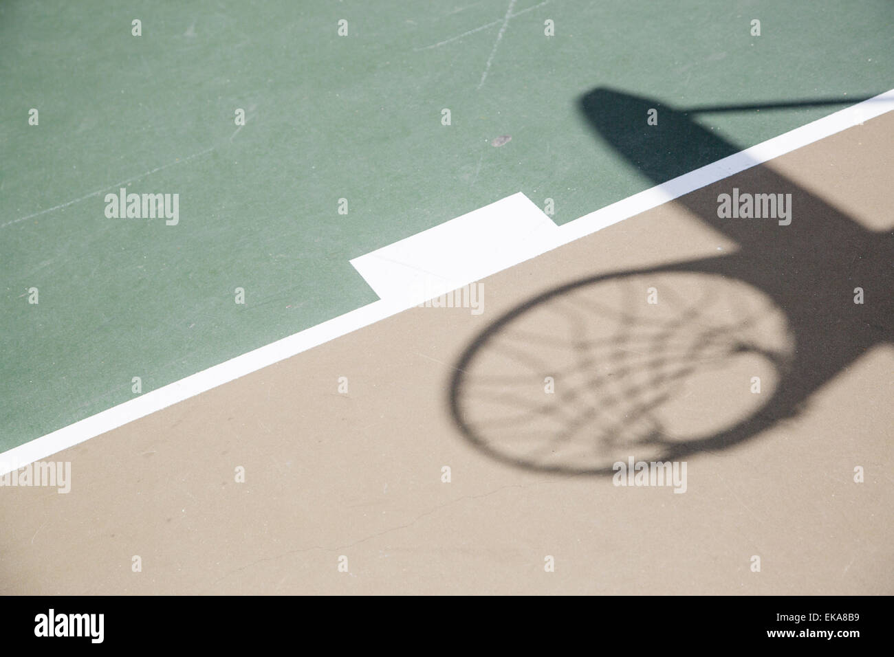 Abstract Shadow of Basketball Hoop and Net Against Court Surface Stock ...