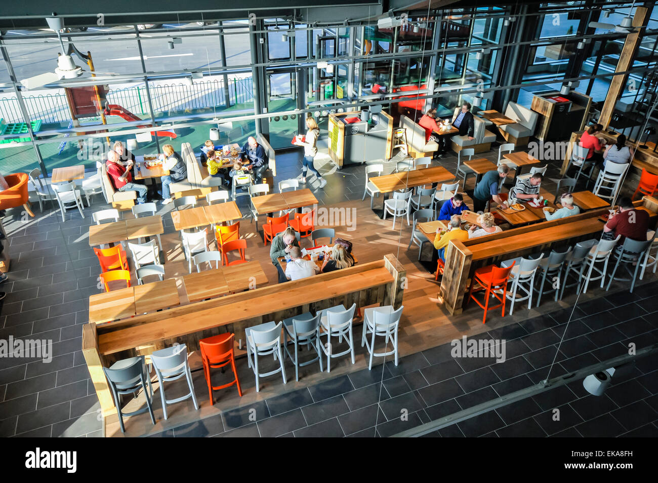 Seating area of a cafe in a motorway service station Stock Photo - Alamy