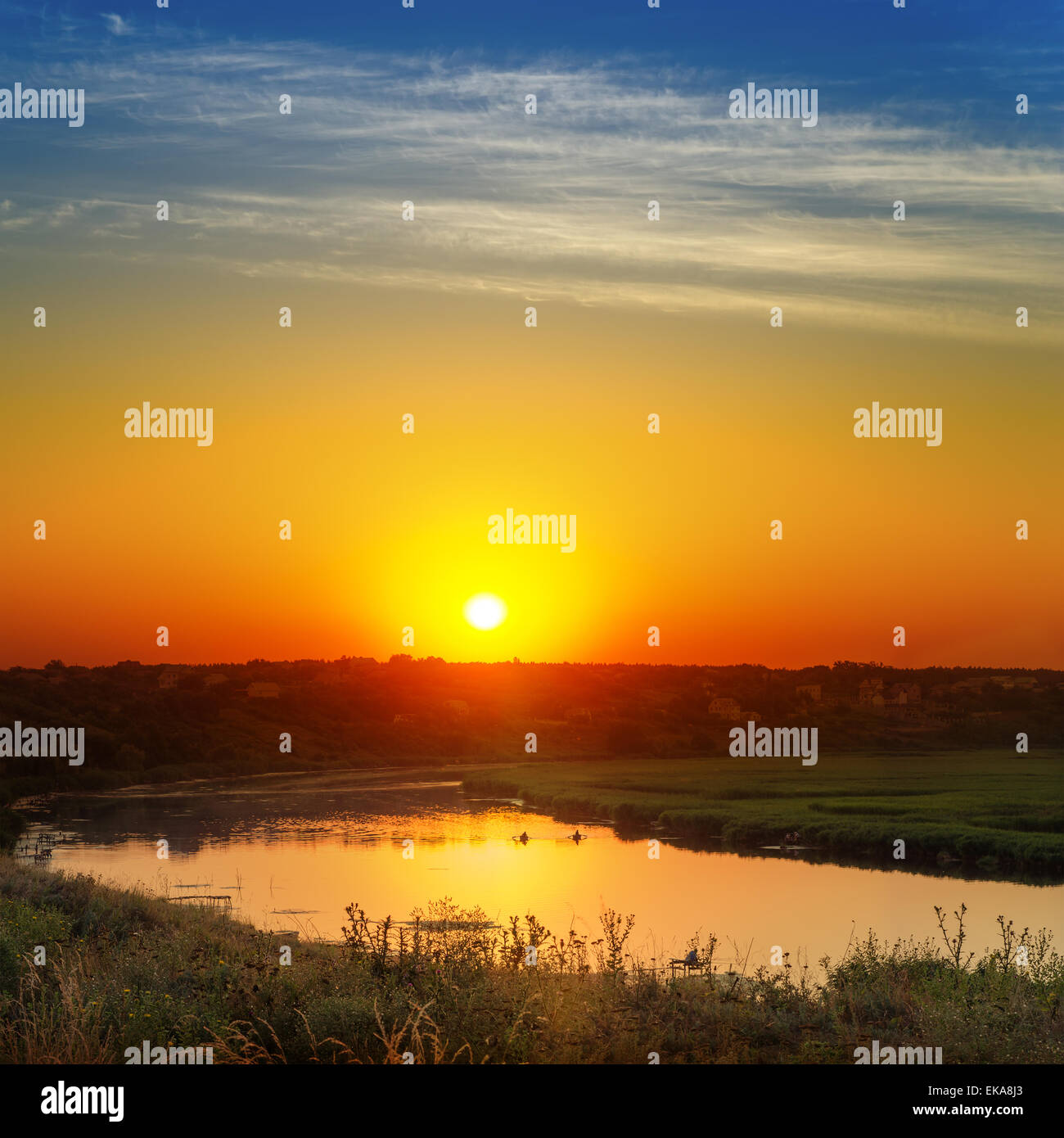 red sunset over river Stock Photo - Alamy