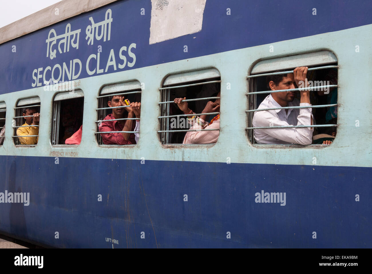 Passengers in a second class railway carriage in India Stock Photo - Alamy