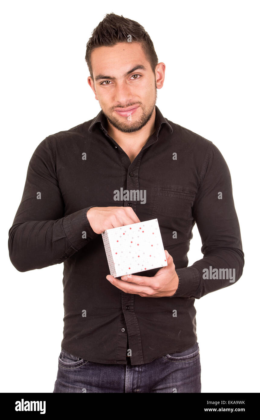 charming young man holding a gift box looking disappointed Stock Photo ...
