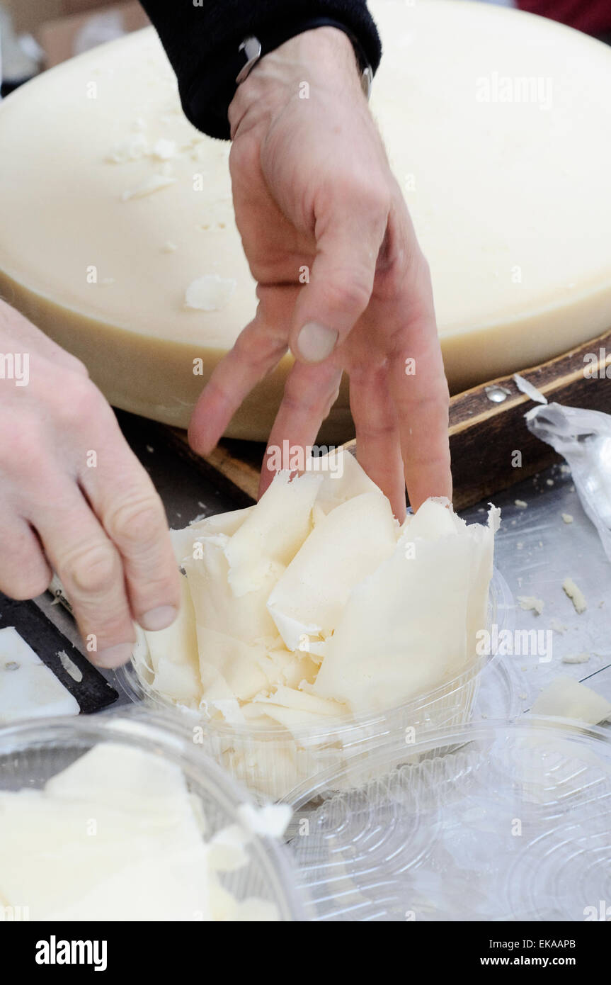 Italy, Lombardy, Lodi, Making of Raspadùra Cheese Sliced Young Parmesan ...