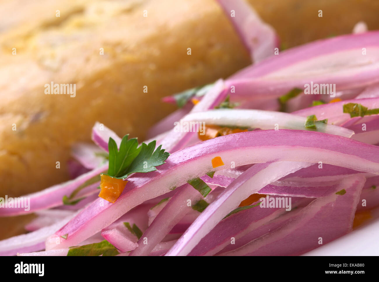 Peruvian Salsa Criolla made of red onion slices, hot pepper called aji ...
