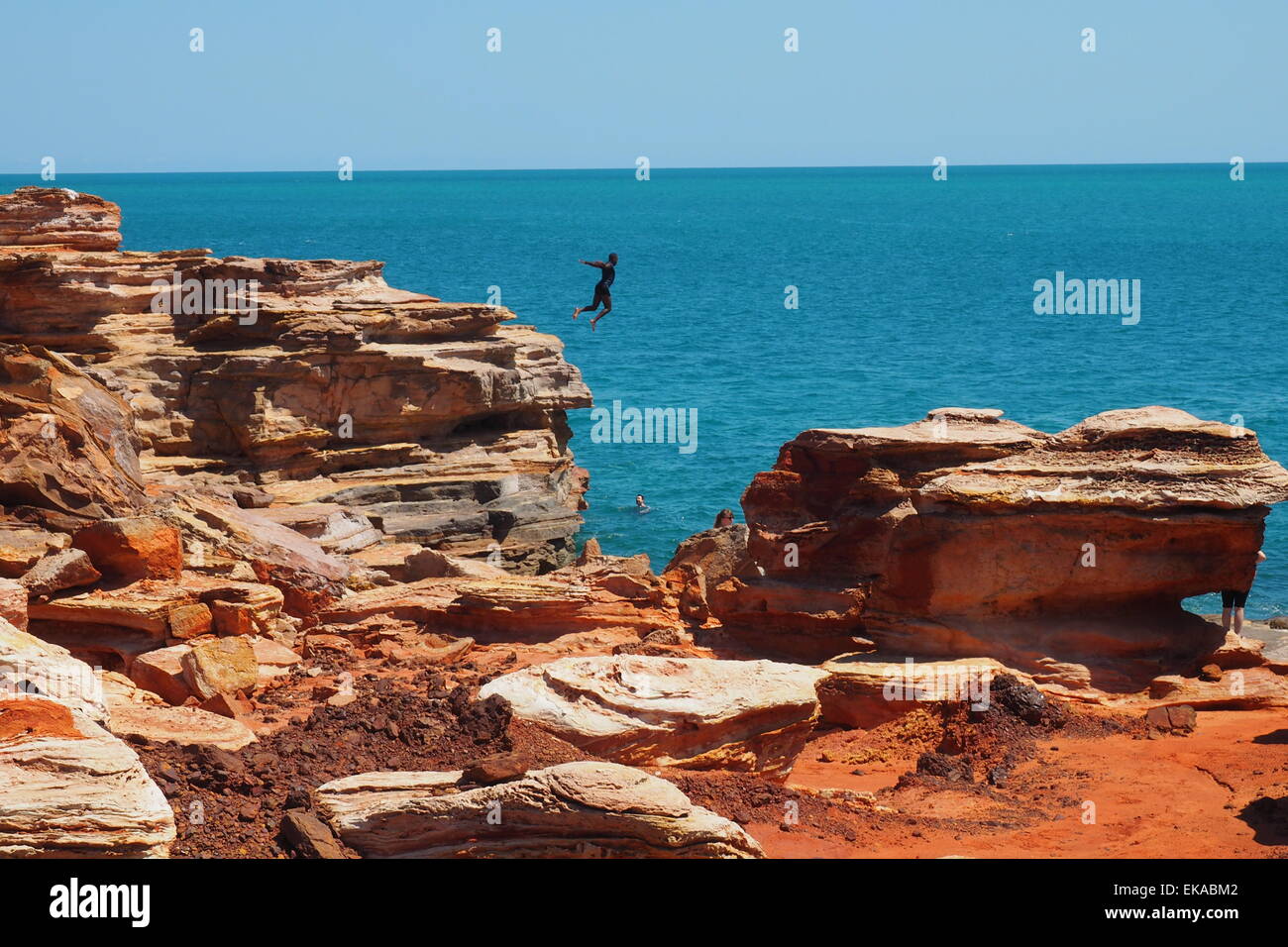People diving off pindan red rocks at Gantheaume Point Broome, Western ...