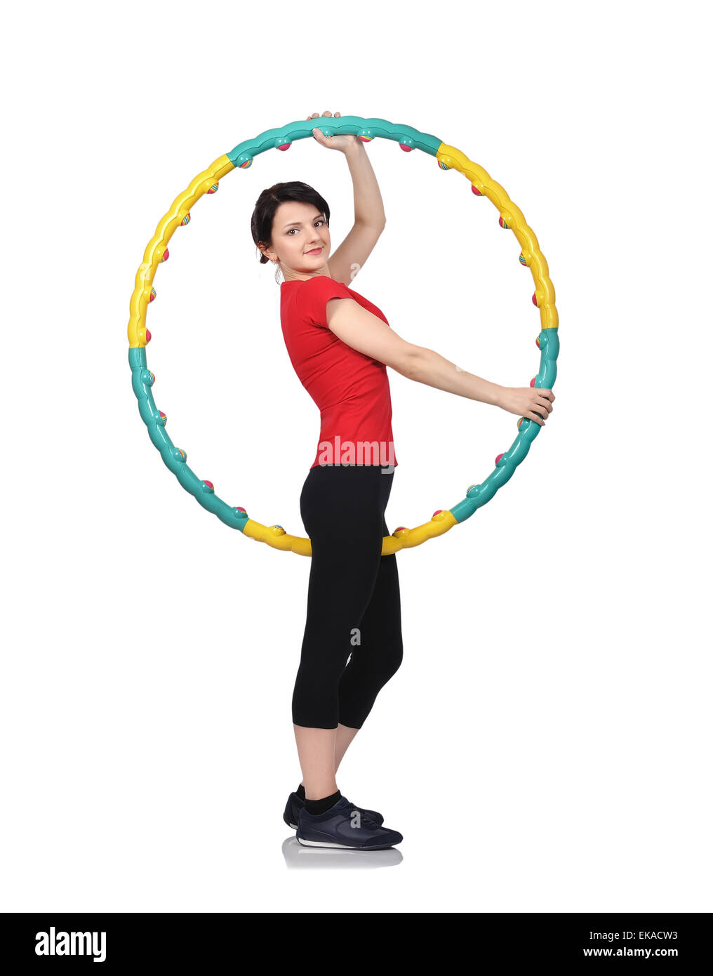 woman standing with color hula hoop on white background Stock Photo - Alamy
