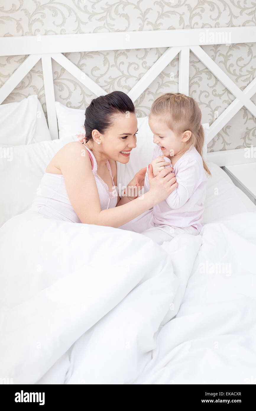 Mother and daughter in bed Stock Photo - Alamy