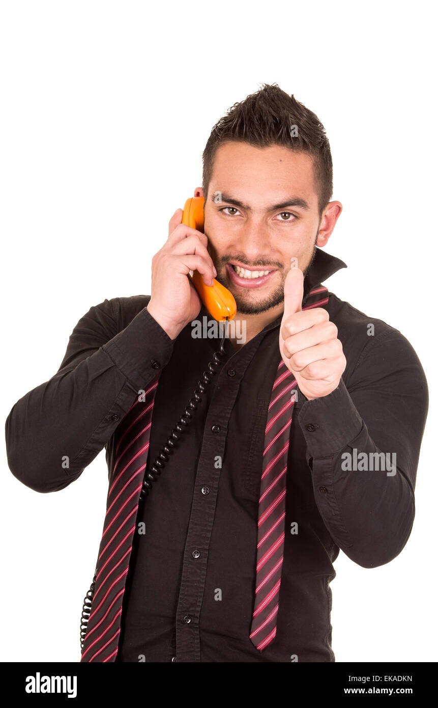 closeup portrait of handsome hispanic man talking on corded retro phone ...