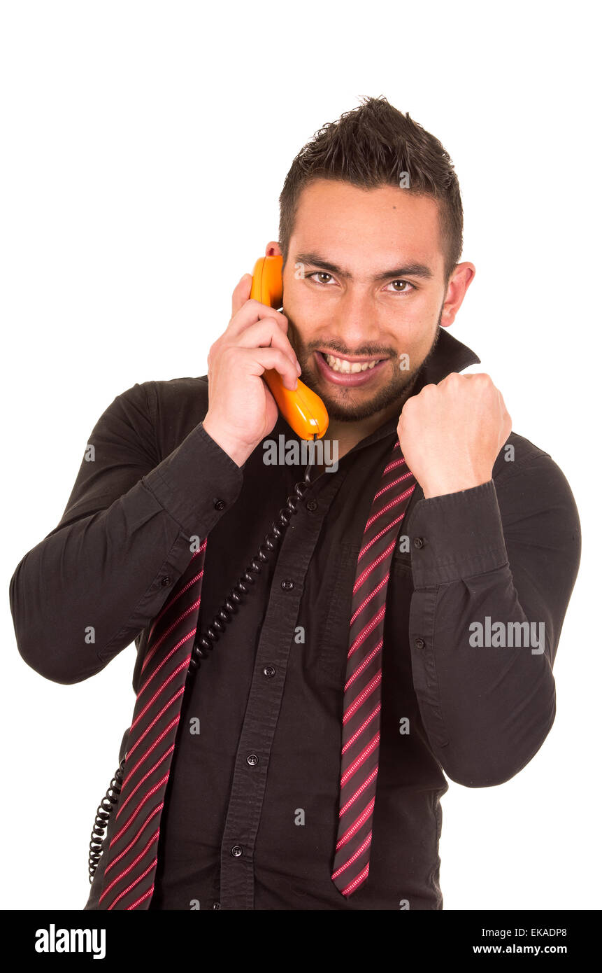 closeup portrait of handsome hispanic man talking on corded retro phone ...