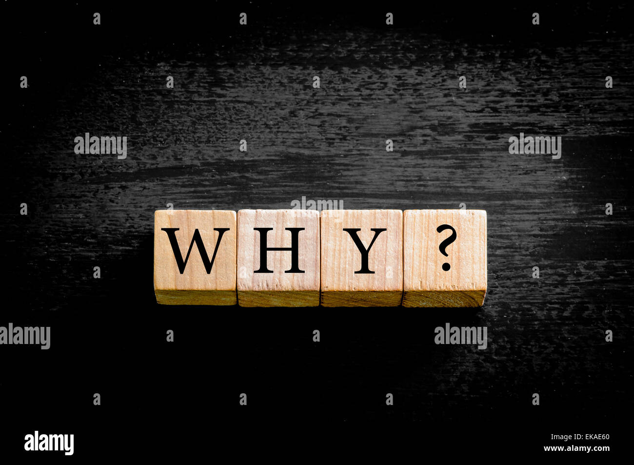 Word WHY. Wooden small cubes with letters isolated on black background ...