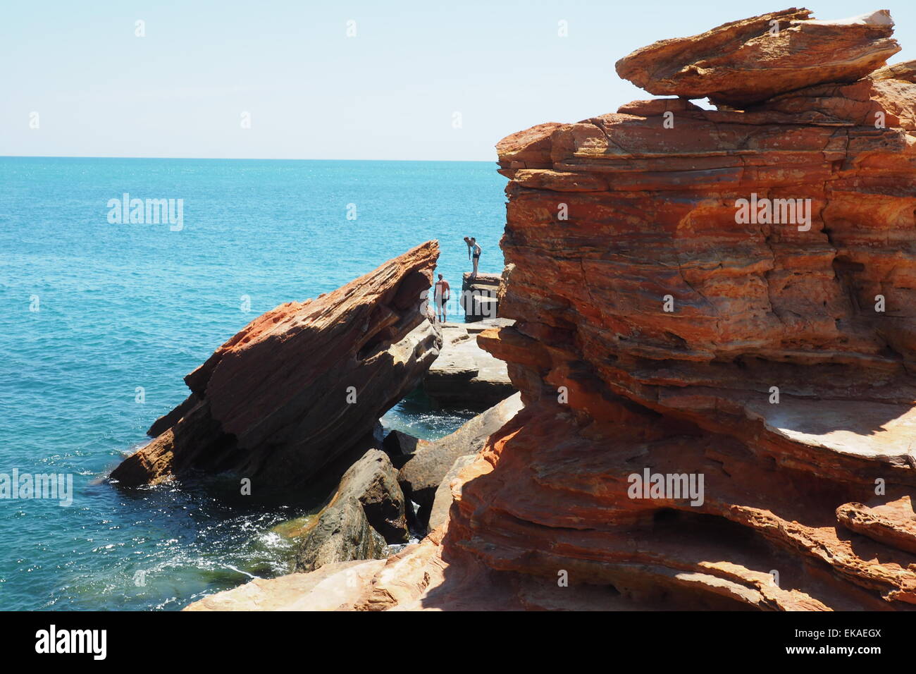 Divers standing on pindan red rocks at Gantheaume Point Broome, Western ...