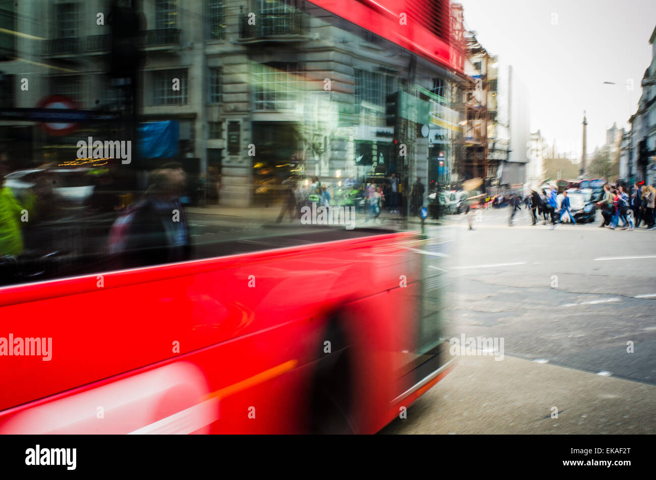 Red London bus passing busy junction at London's Piccadilly at the ...