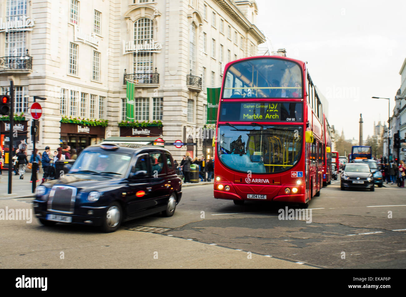A busy junction, buses, commuters, taxis, at London's Piccadilly at the ...
