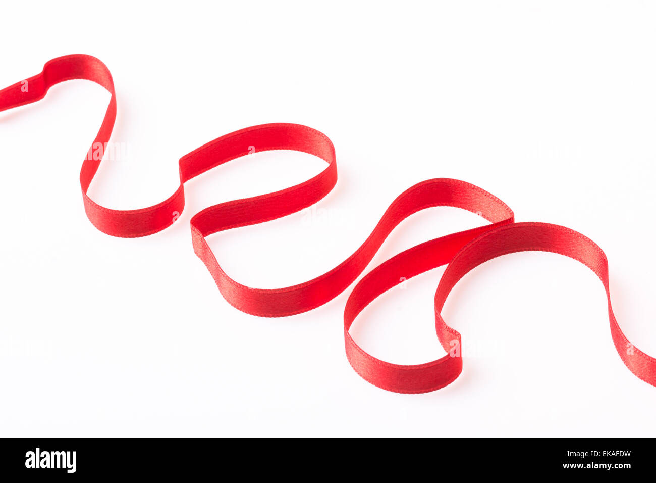 Red silk twisted ribbon in the form Stock Photo - Alamy