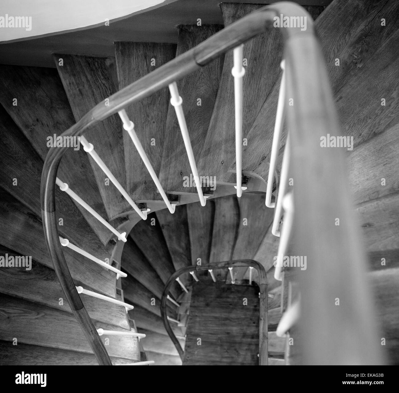Looking down through a winding wooden staircase Stock Photo - Alamy