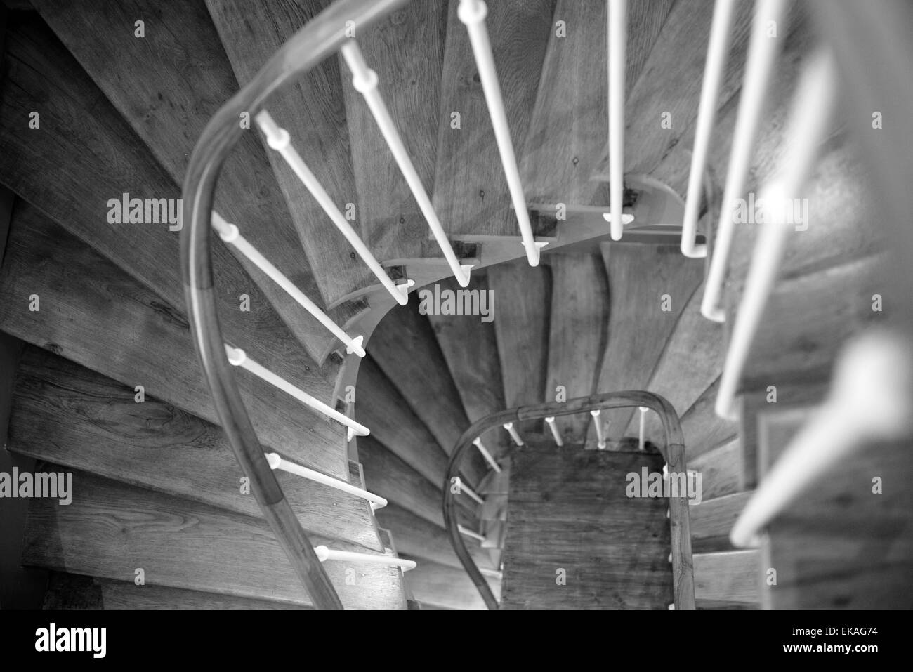 Looking down through a winding wooden staircase Stock Photo - Alamy