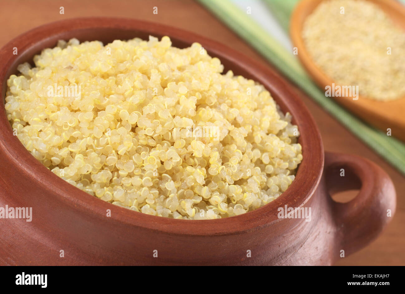 Cooked white quinoa in rustic bowl which can be eaten as a side dish ...