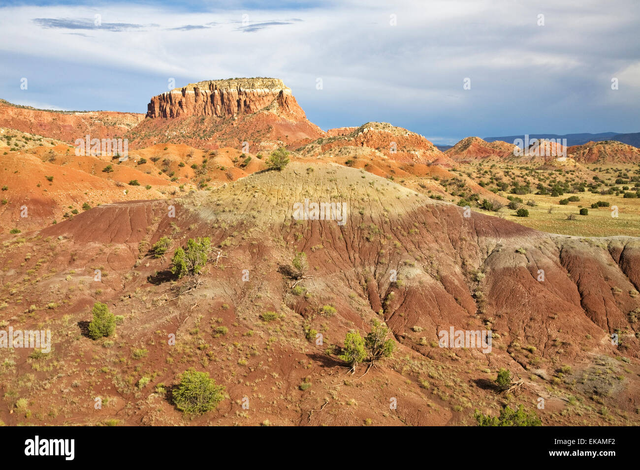 The red cliffs of Kitchen Mesa around the resort of Ghost Ranch near ...