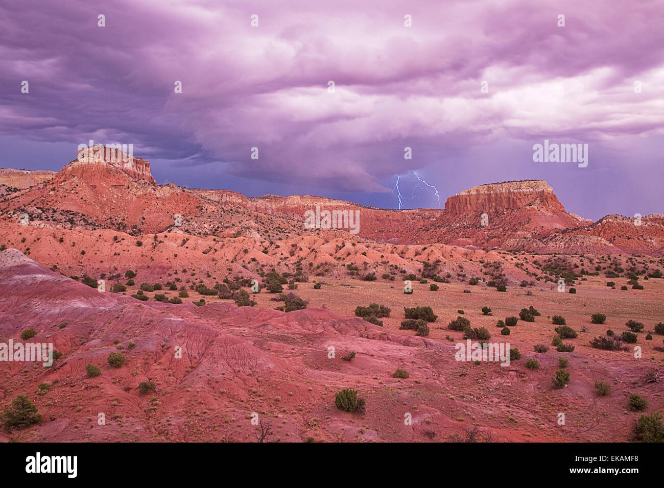 The red sandstone cliffs of Kitchen Mesa at Ghost Ranch become even ...