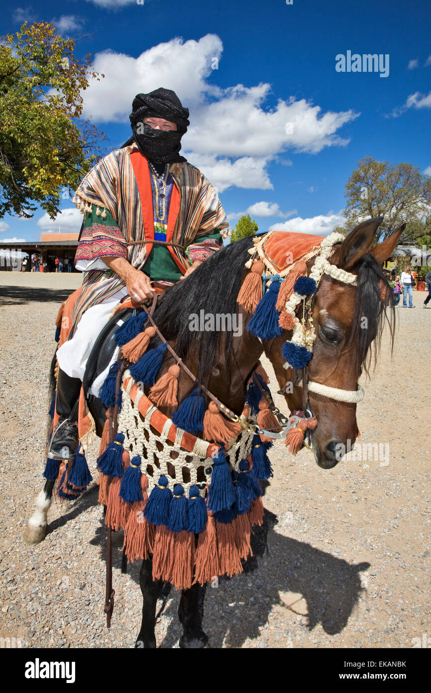 Dressed in a colorful period costume, Danny SalDaNa rides his arabian ...
