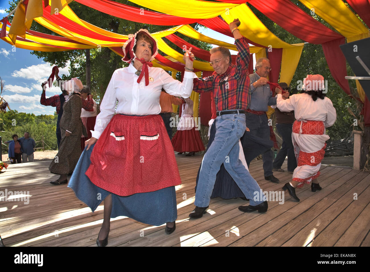 A colorfully dressed troupe of volunteers demonstrates traditional folk ...