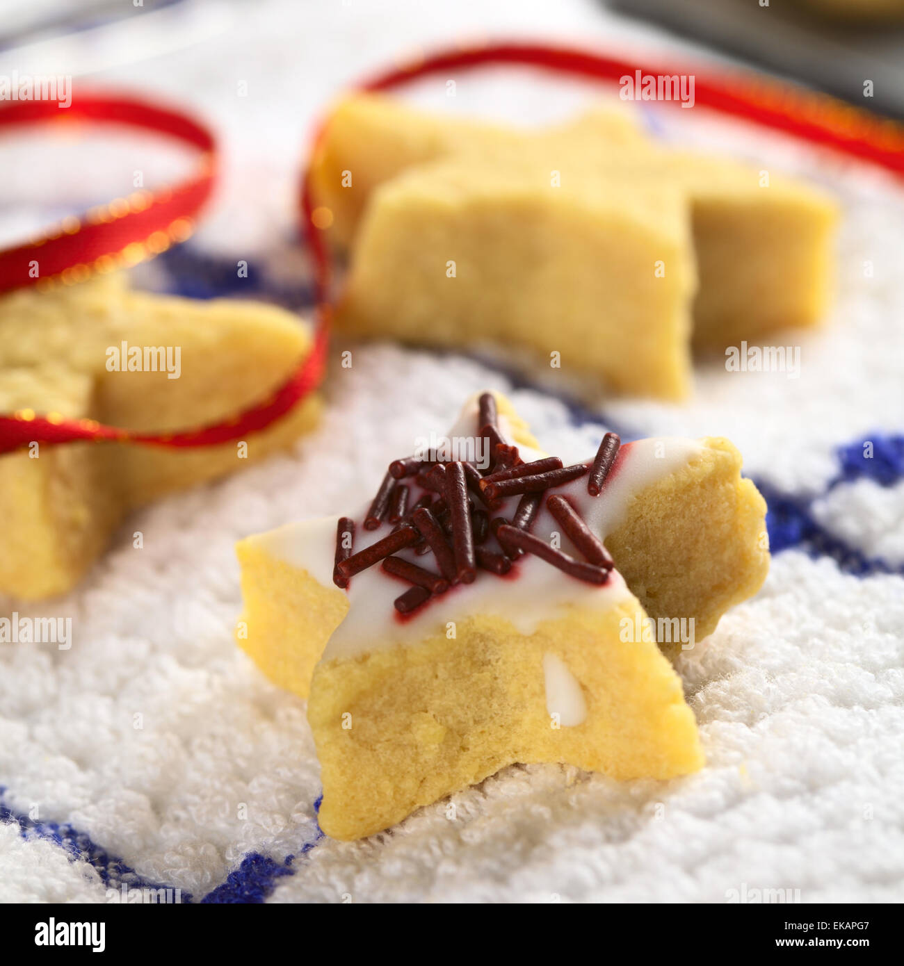 Star shaped cookie with sugar icing and chocolate sprinkles (Selective ...