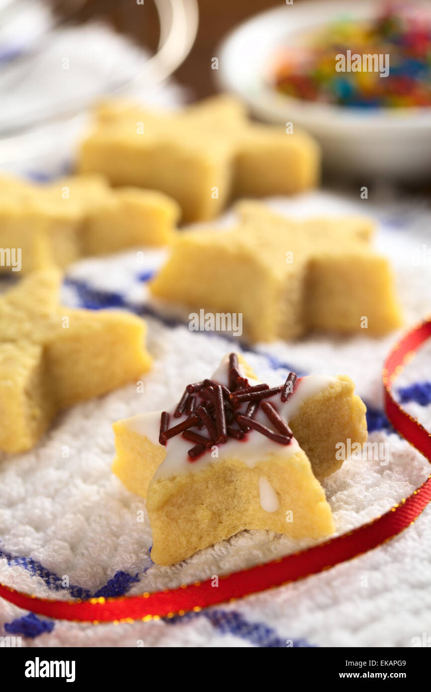 Star shaped cookie with sugar icing and chocolate sprinkles (Selective ...