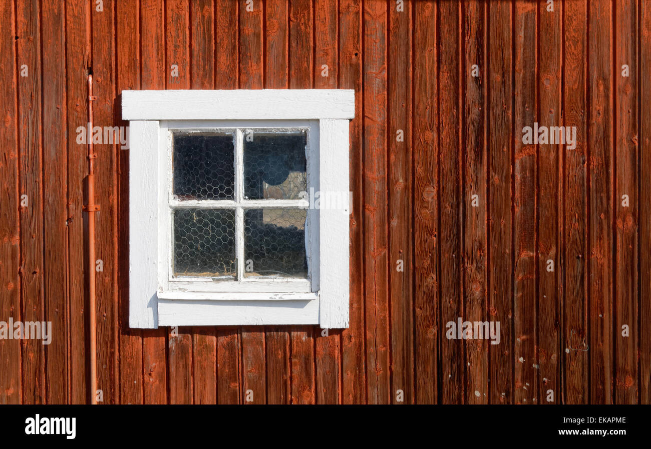 Red traditional barn wall and an old window Stock Photo - Alamy