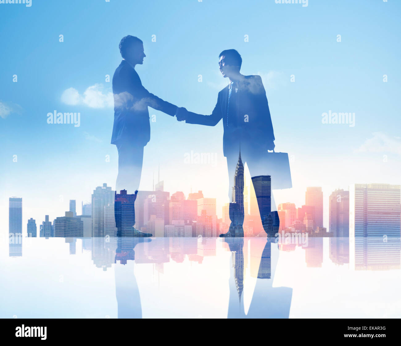 Silhouettes of Two Businessmen Having a Handshake Stock Photo - Alamy