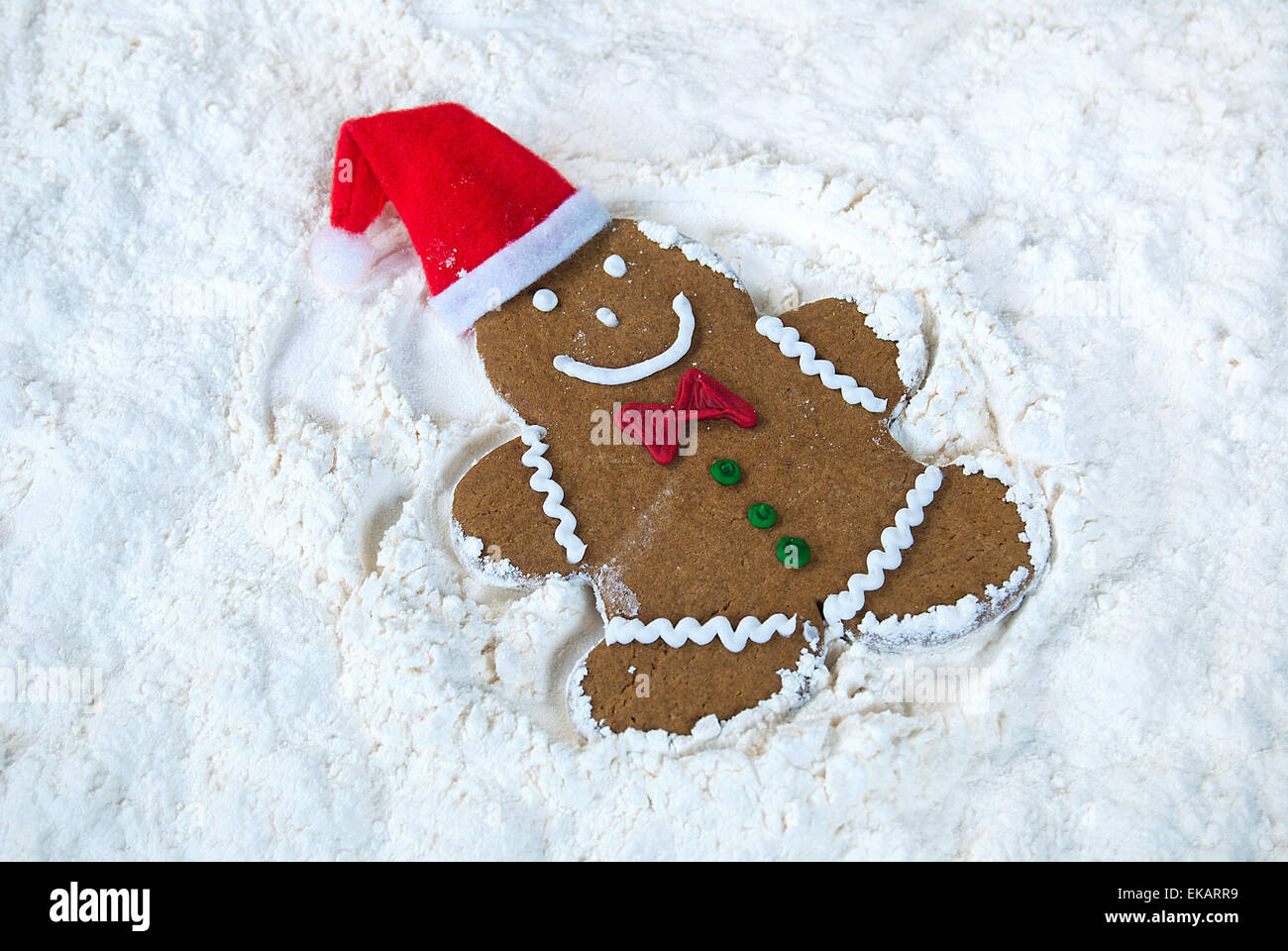 Christmas snow angel gingerbread man in white flour Stock Photo - Alamy