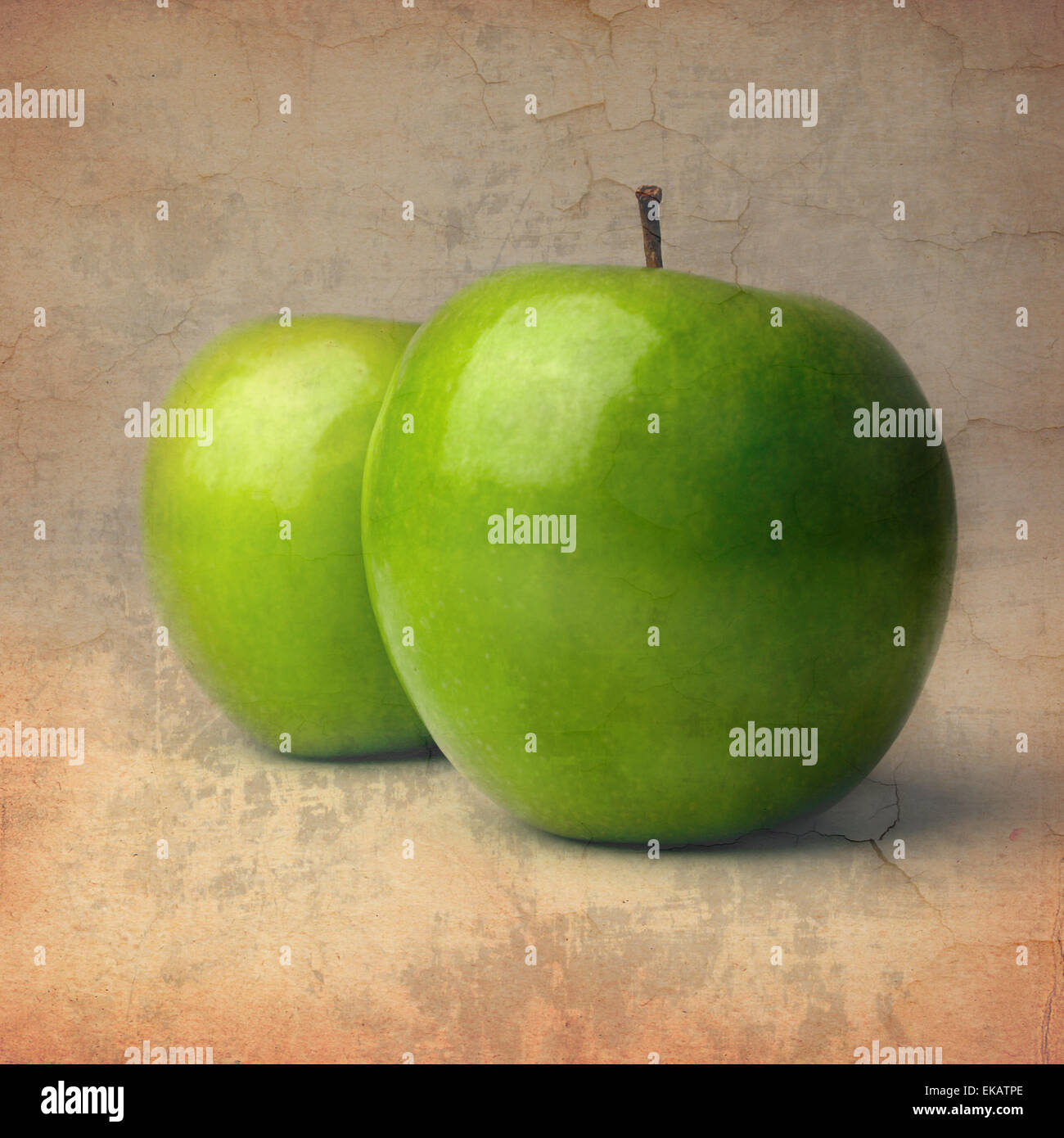 Two green apples on a kitchen table Stock Photo - Alamy