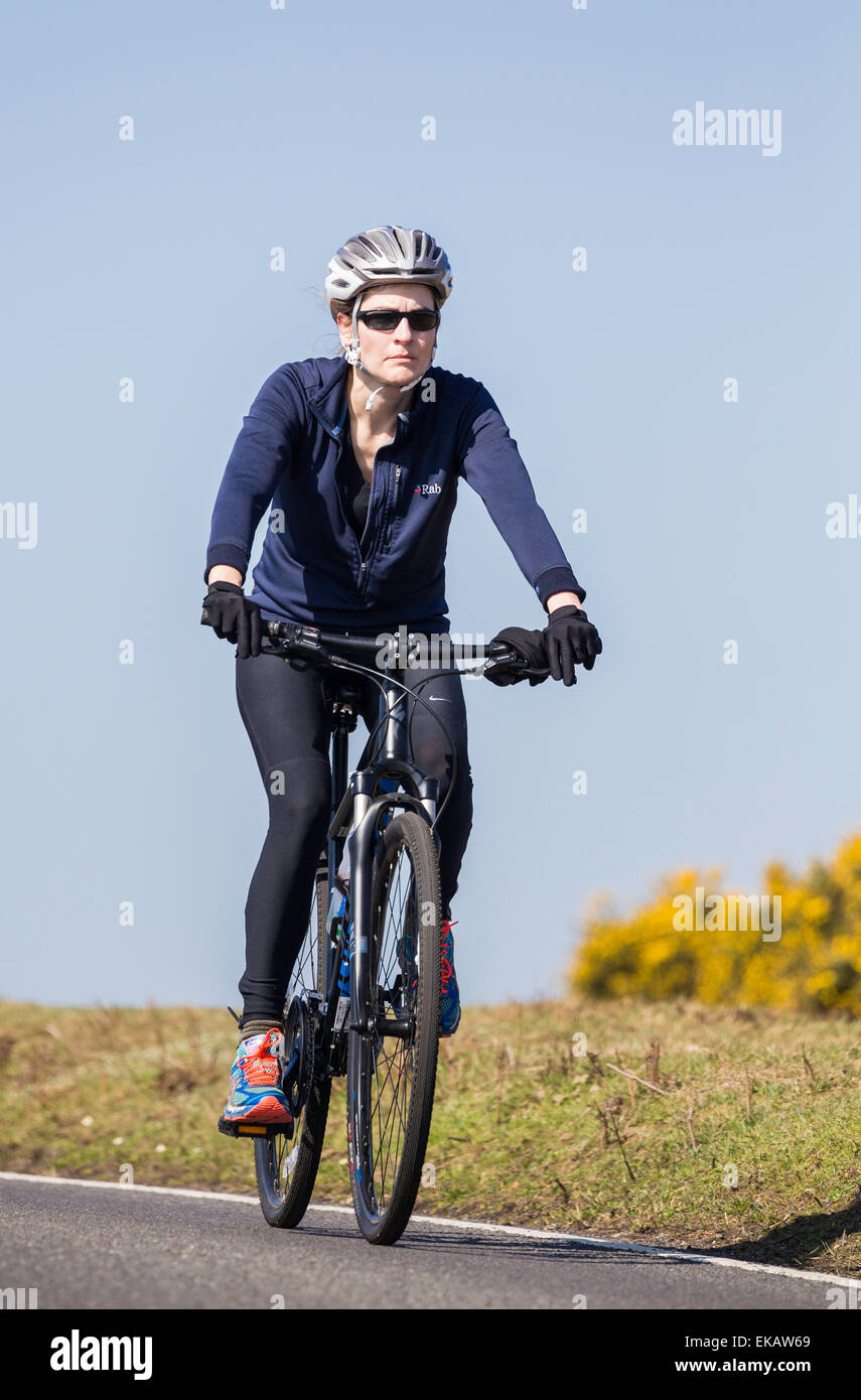 A female cyclist competes in the New Forest Wiggle Sportive event on a ...