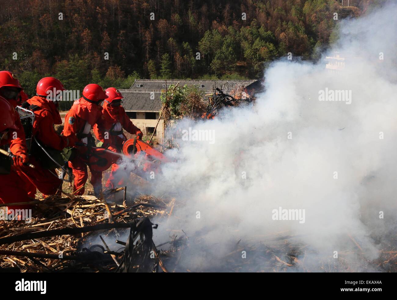 Liangshan, China's Sichuan Province. 9th Apr, 2015. Firefighters take ...