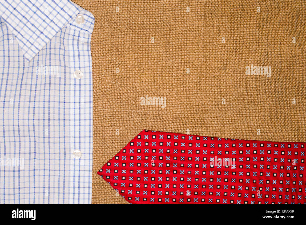 Red tie and plaid shirt on the old sacking Stock Photo - Alamy