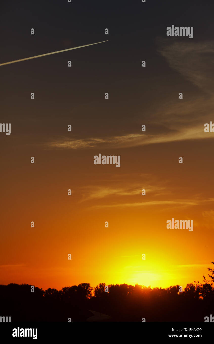 setting sun and sky with clouds Stock Photo - Alamy