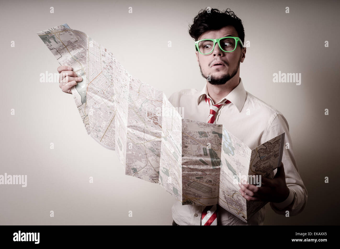 lost businessman with map Stock Photo - Alamy