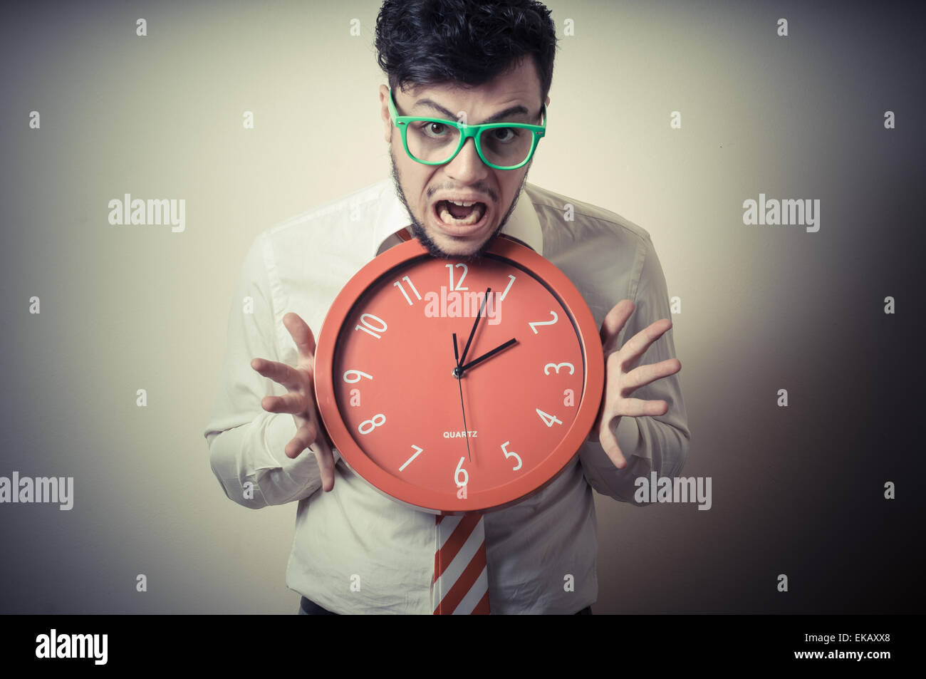 funny businessman with wall clock Stock Photo - Alamy