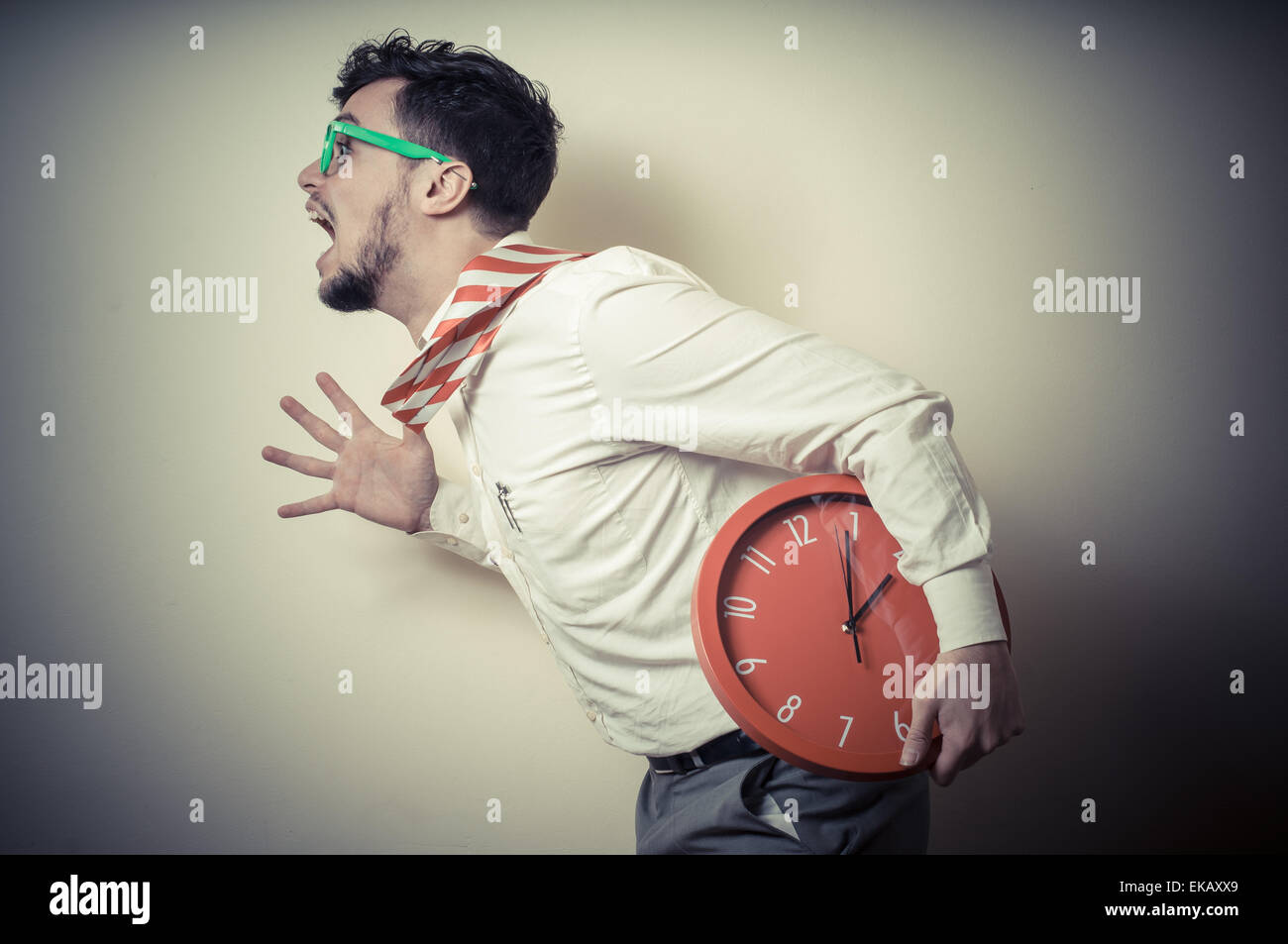 funny businessman with wall clock Stock Photo - Alamy