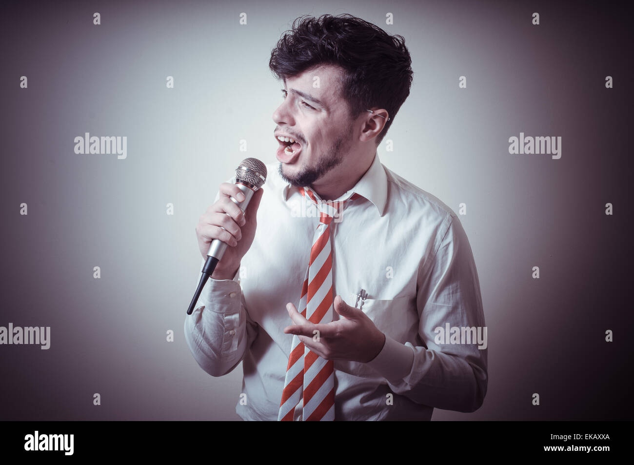 funny stylish businessman singing Stock Photo - Alamy