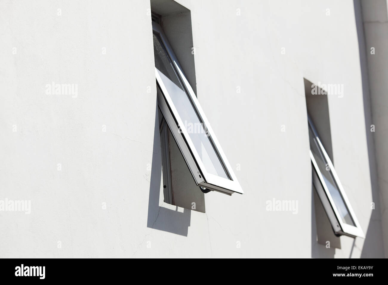 two open windows on the background of the house Stock Photo - Alamy