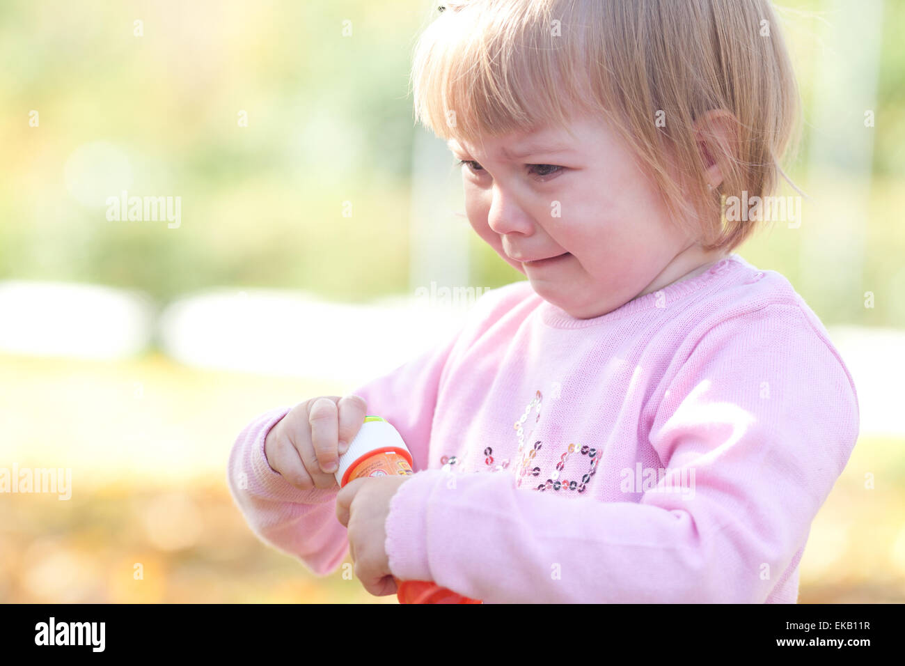 beautiful little girl crying on the autumn forest Stock Photo - Alamy