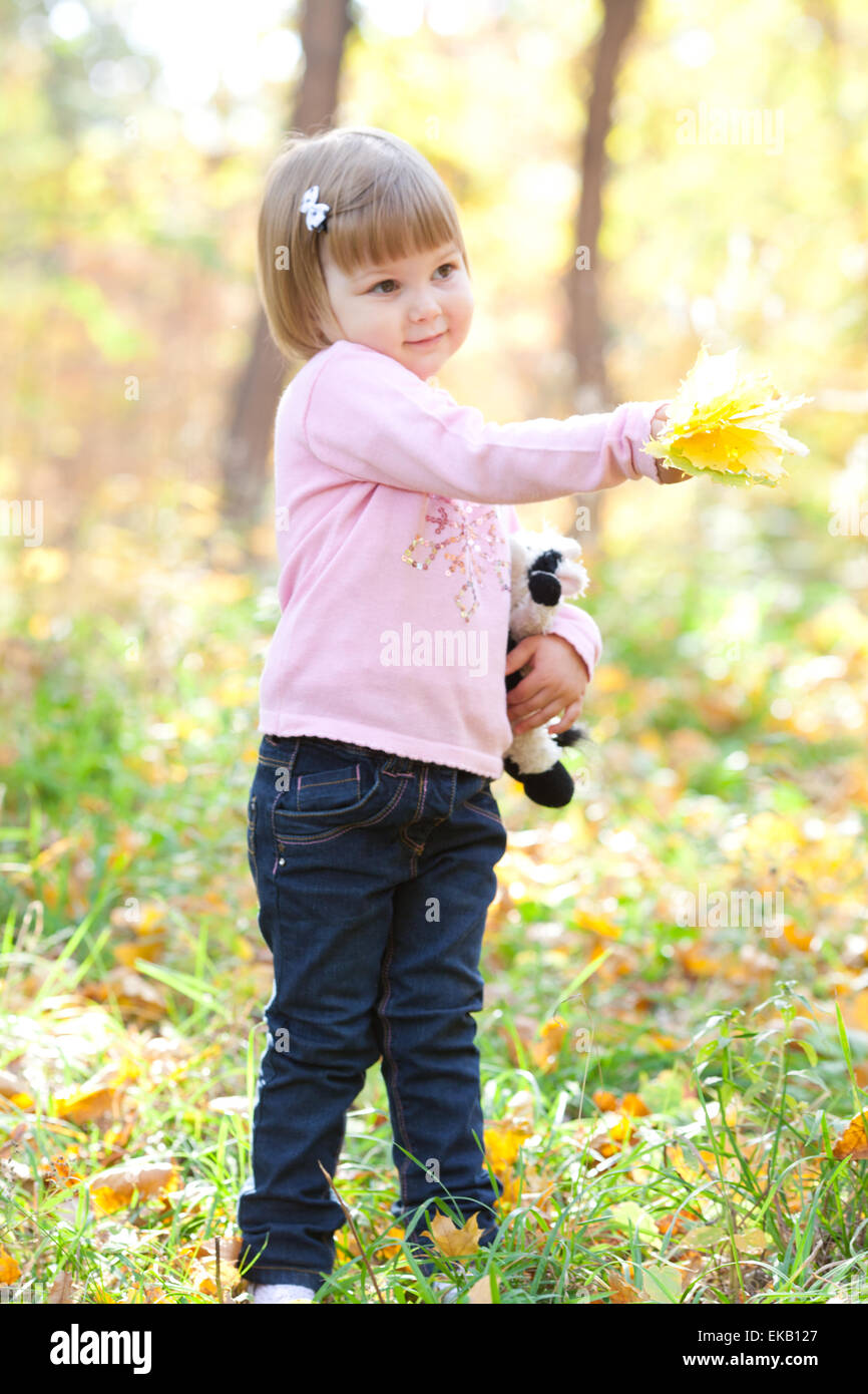 beautiful little girl on the autumn forest Stock Photo - Alamy