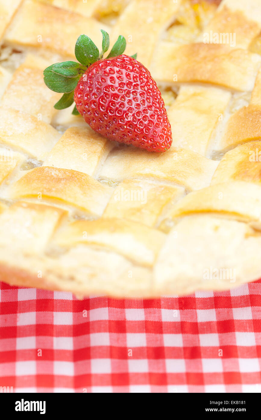 apple pie and a strawberry on plaid fabric Stock Photo - Alamy