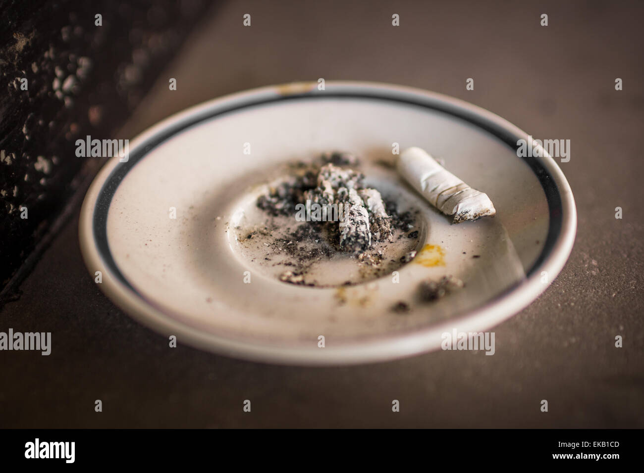 A saucer used as ashtrays Stock Photo - Alamy