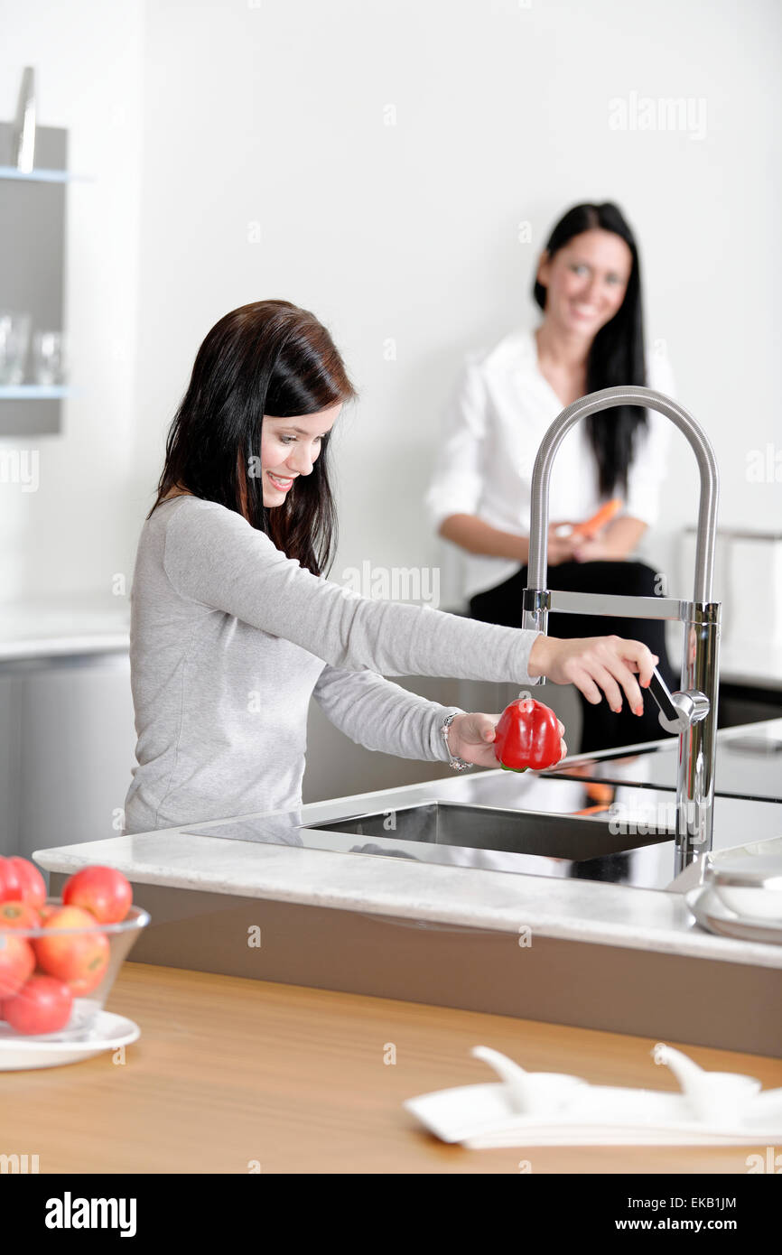 Two friends cooking together Stock Photo - Alamy