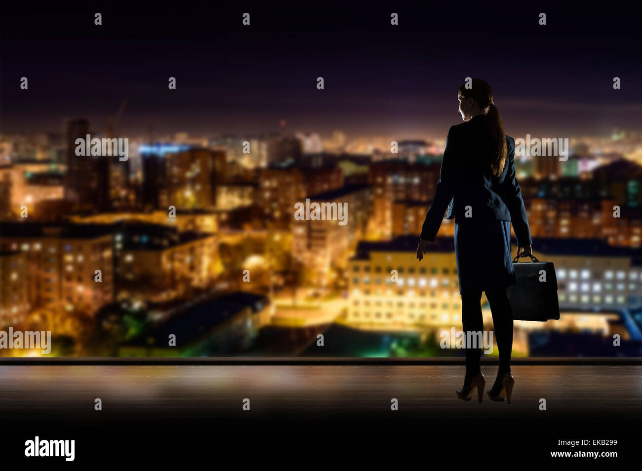 Business woman standing at the window Stock Photo - Alamy